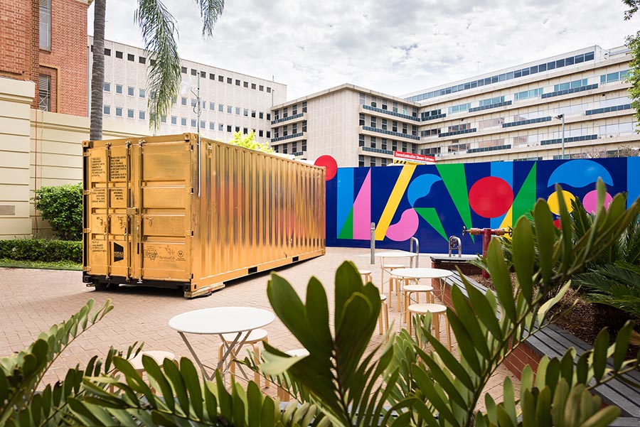 What’s Inside This Curious Gold Shipping Container?