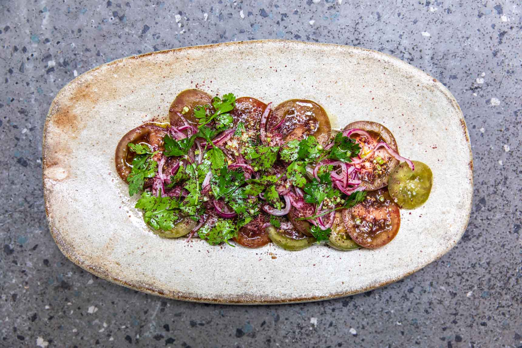 Recipe: A Punchy Middle Eastern Tomato Salad Perfect for Spring Snacking