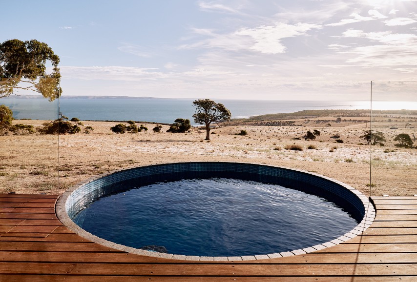 Soak Up Views of Bushland and Rugged Coastline From a Heated Plunge ...
